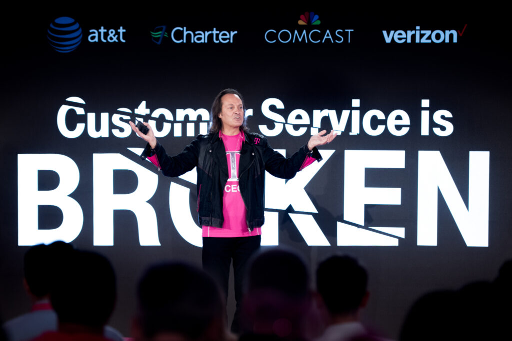 T‑Mobile CEO John Legere addresses the audience at T‑Mobile’s Un ...